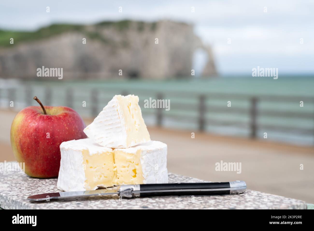 Tasting of round camembert cow cheese from Calvados region served ...