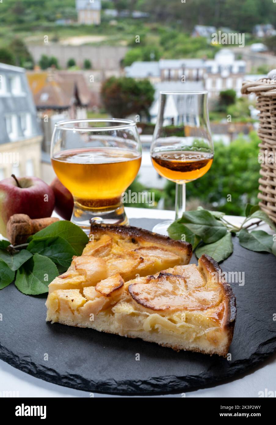 Apple products of Normandy region, homemade baked apple cake, glasses ...