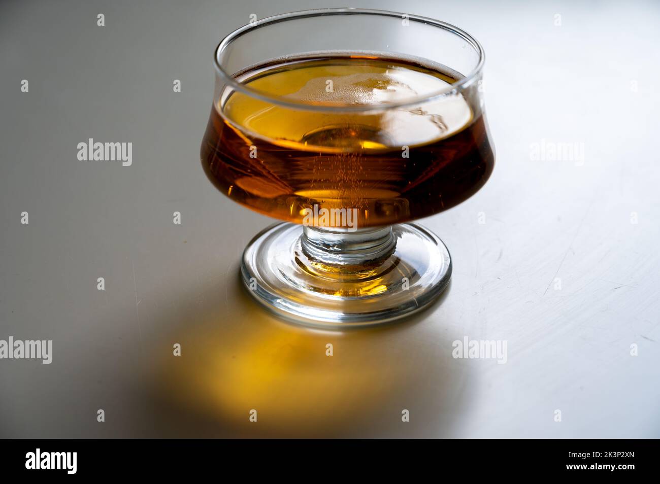 One glass of apple cider drink on white table, Normandy, France Stock ...