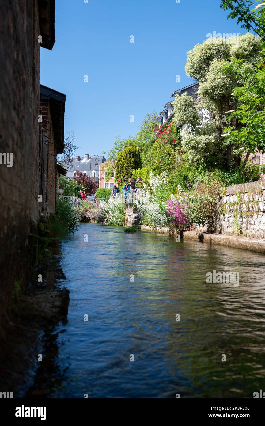 Small river flows throughout beautiful French village Veules-les-Roses ...