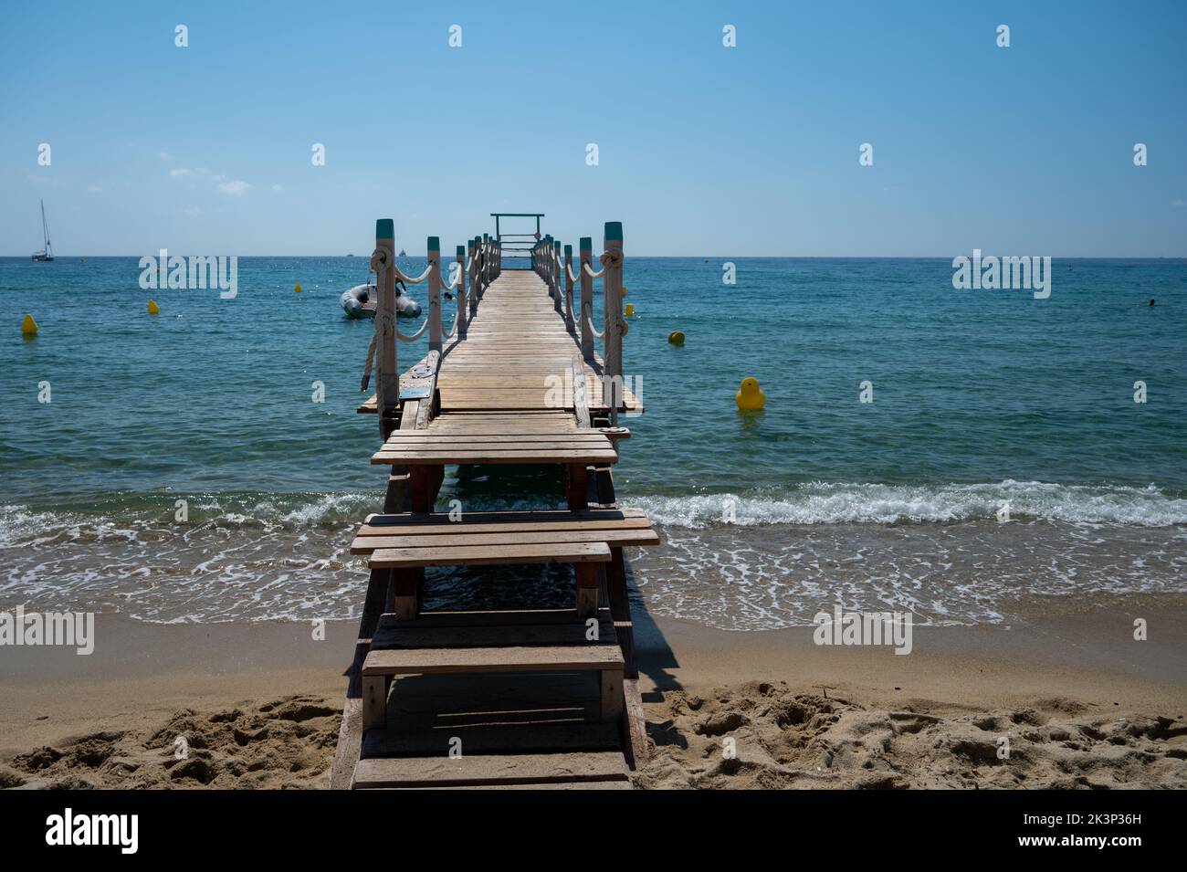 Wooden pier for guests of yachts on legendary Pampelonne beach near ...