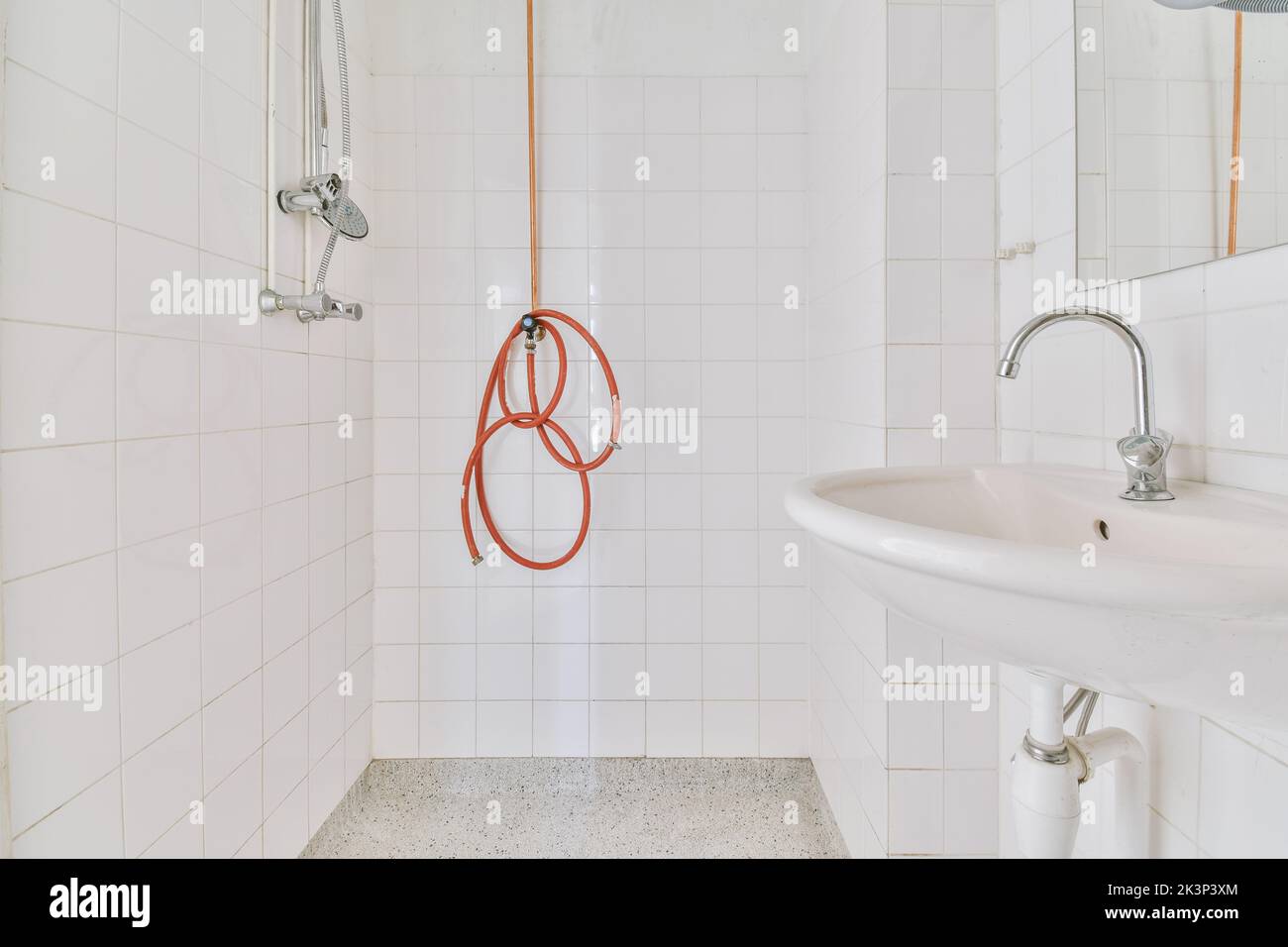 Sinks with mirrors and shower box with glass door in modern bathroom ...