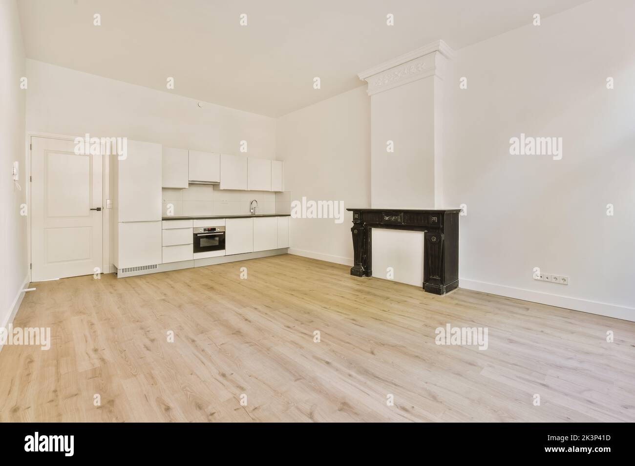 Interior of empty white kitchen with windows and wooden parquet floor ...