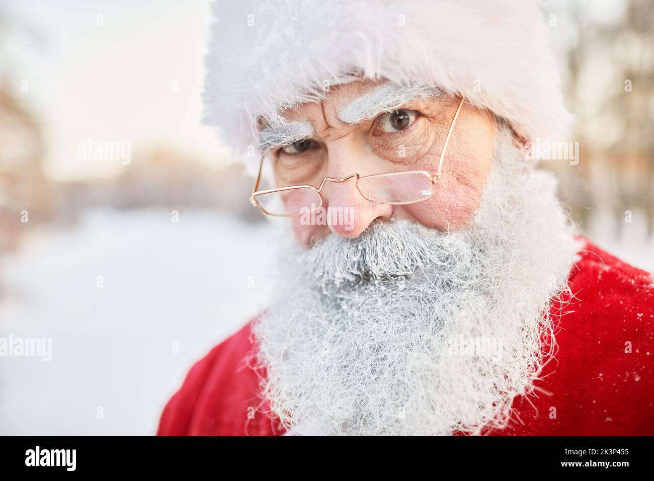 Closeup portrait of serious Santa Claus looking at camera over ...