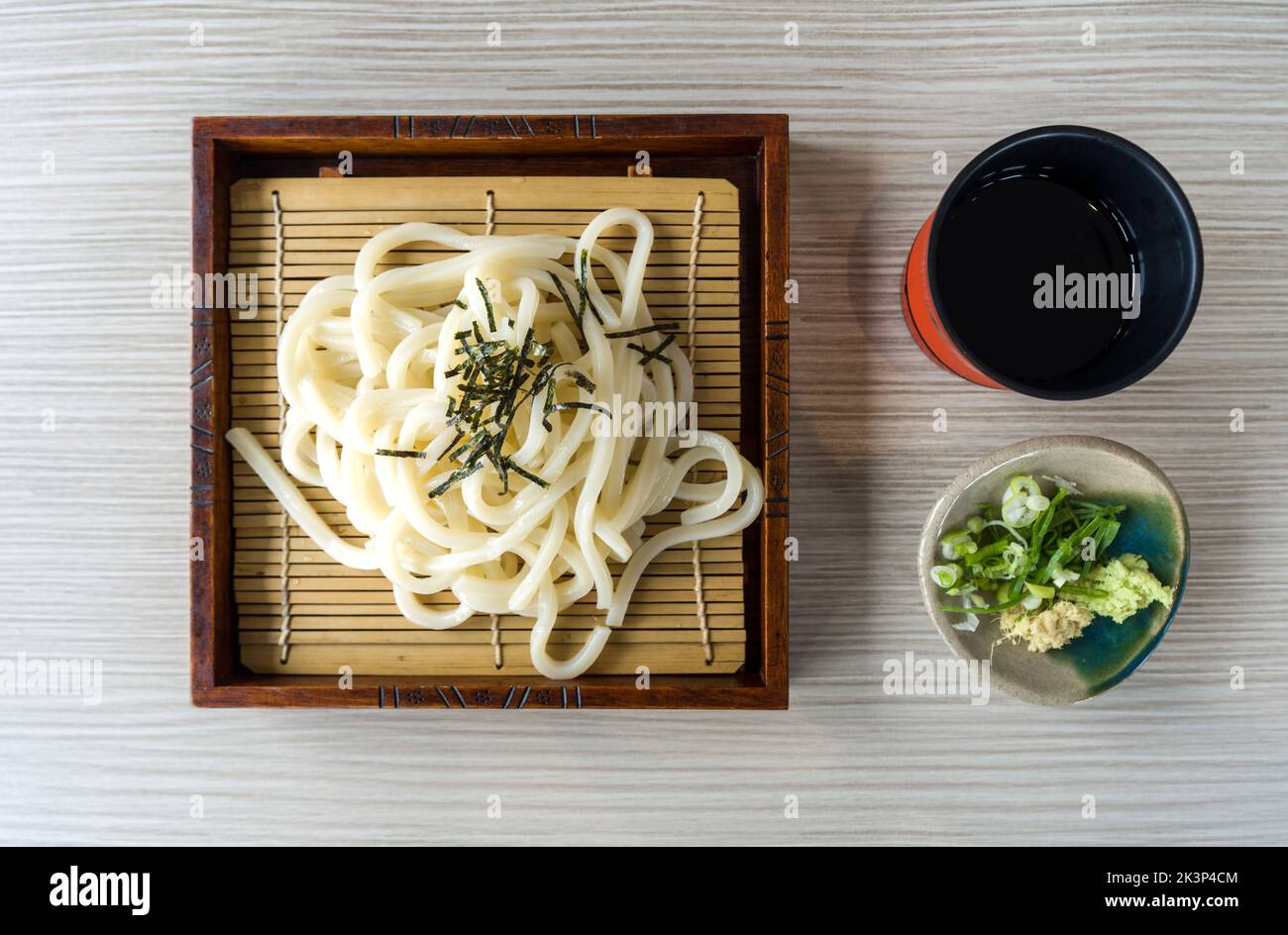 Chilled Zaru Udon, noodles with cut roasted seaweed served in a bamboo ...