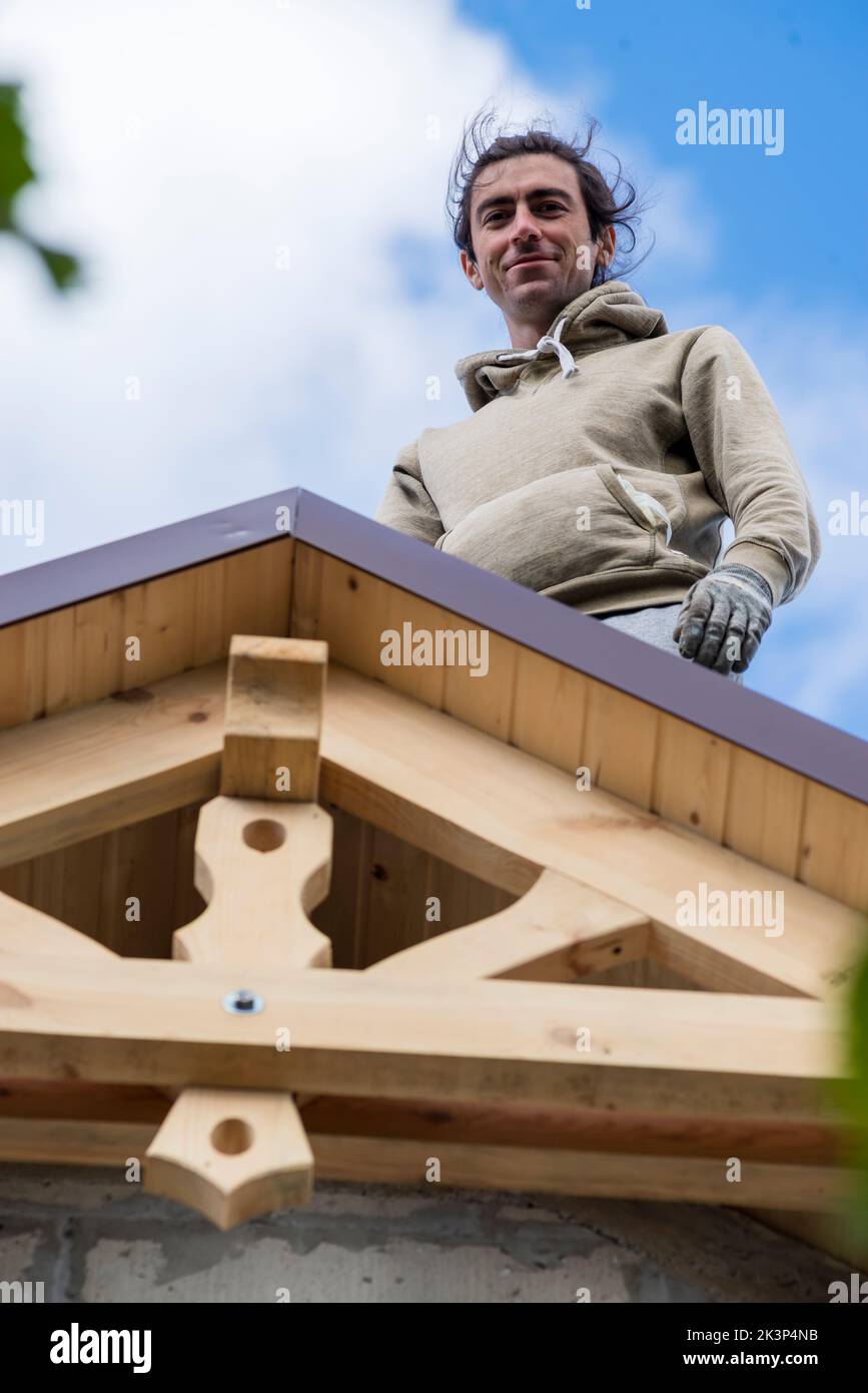 three Roofer man roof carpenter working Country house renovation ...