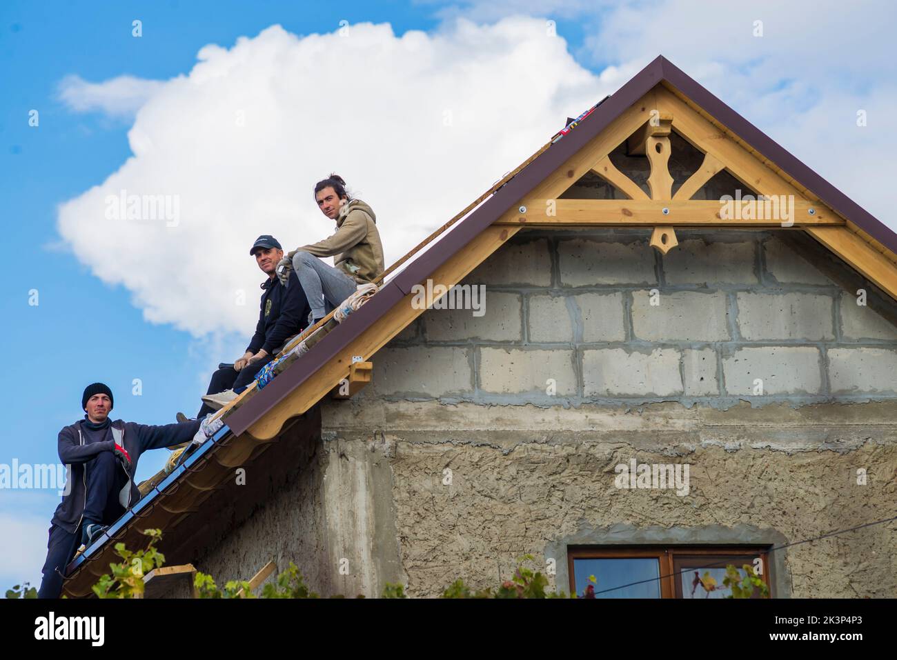 three Roofer man roof carpenter working Country house renovation ...