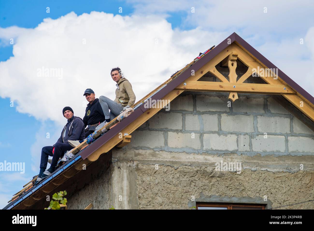 three Roofer man roof carpenter working Country house renovation ...