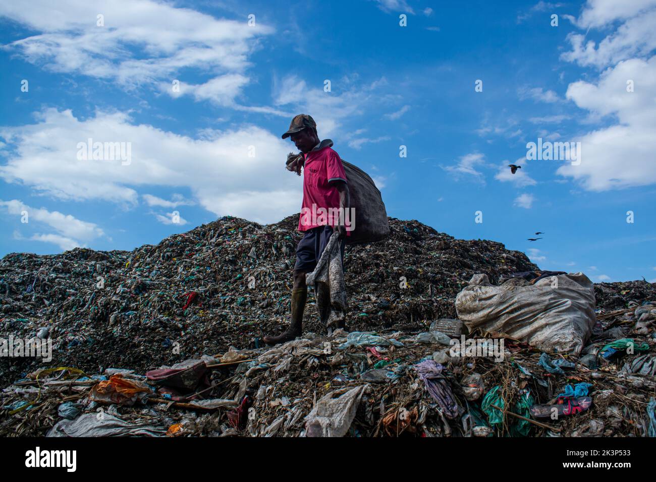 Low-income people are searching for recyclables from garbage dumping ...