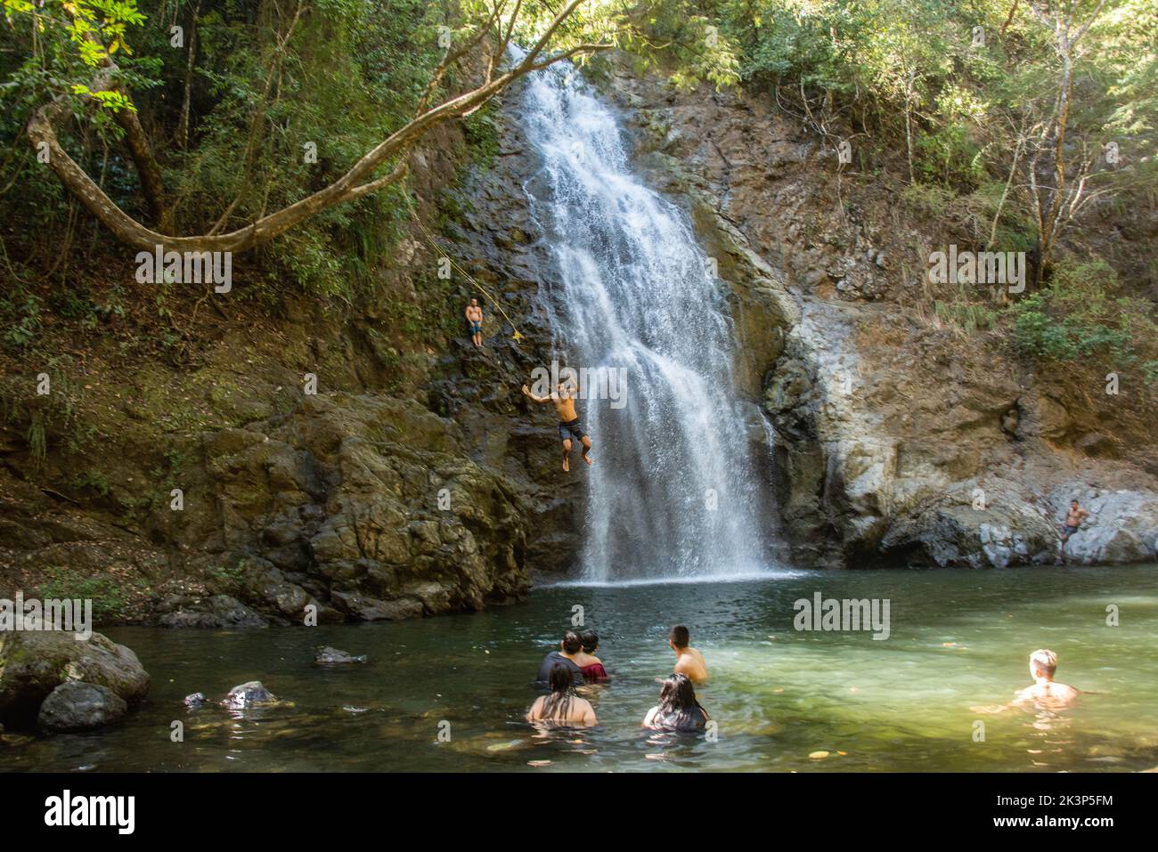 Enjoying the cascades at Montezuma Waterfall, Puntarenas, Costa Rica ...