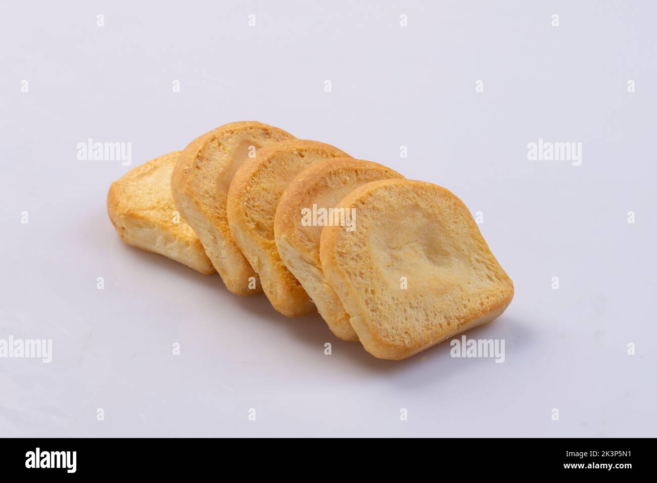 Crunchy Rusk or Toast for healthy life. Rusks creating a domino effect ...