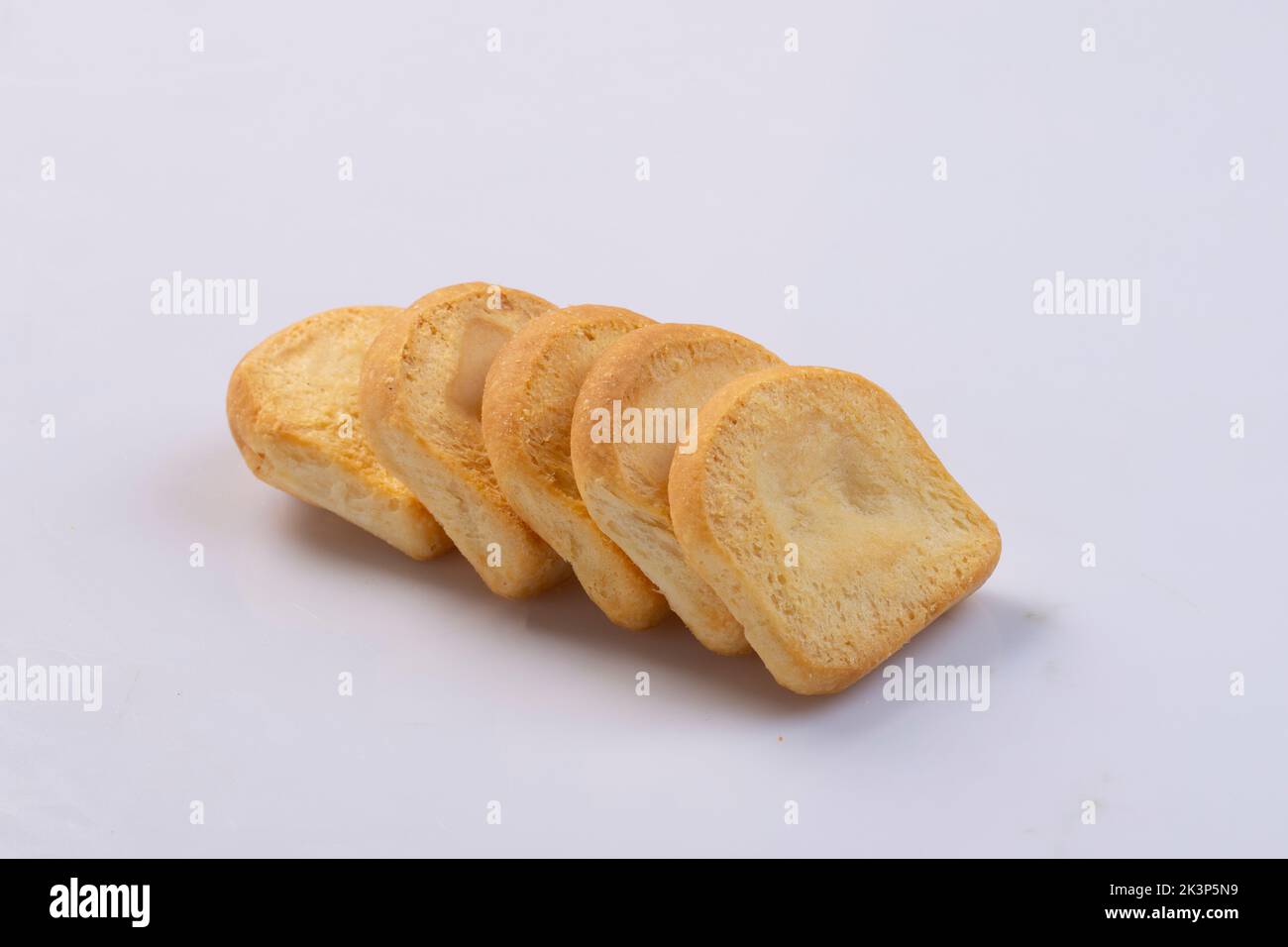Crunchy Rusk or Toast for healthy life. Rusks creating a domino effect ...
