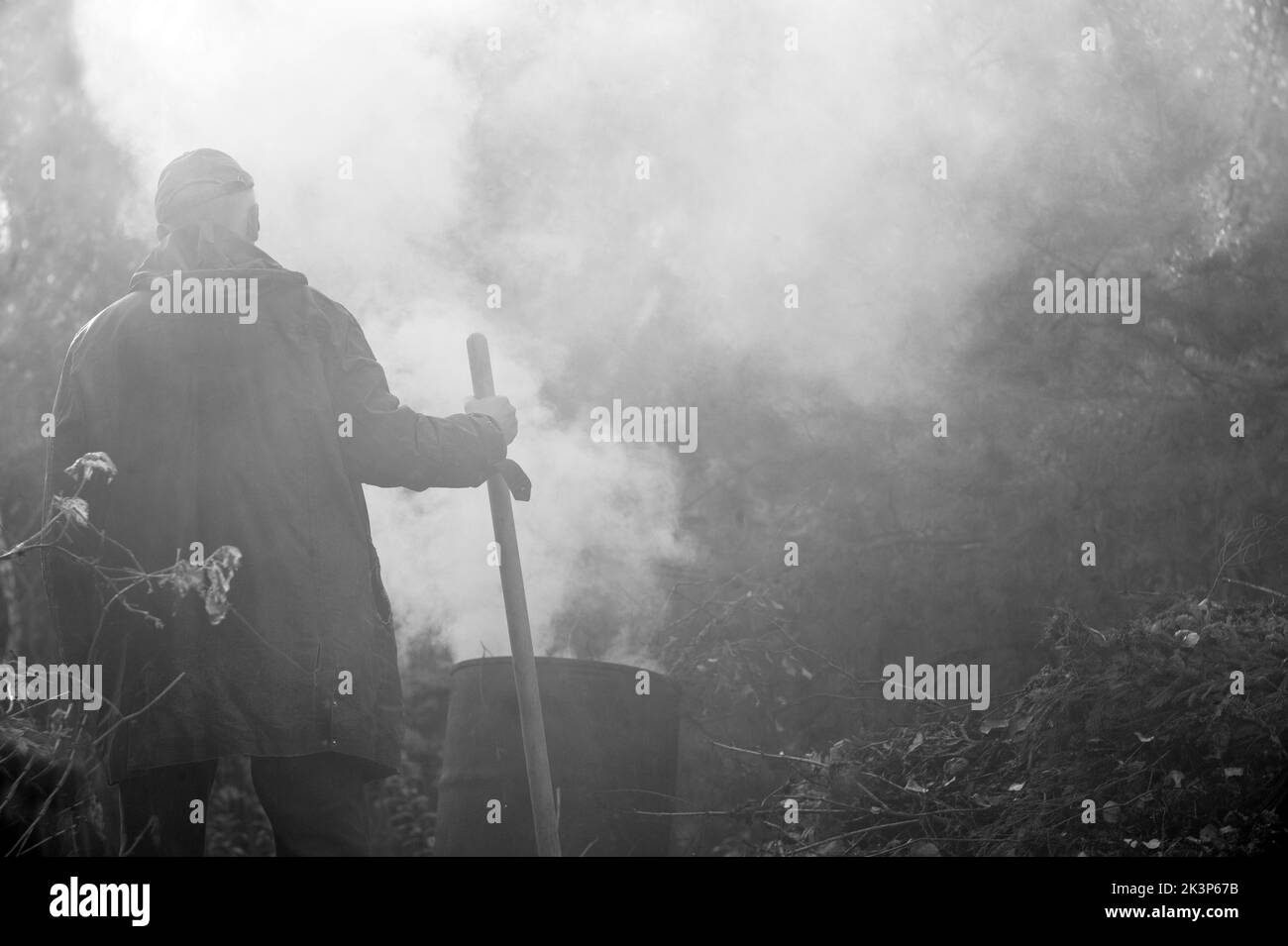Man standing in smoke Black and White Stock Photos & Images - Alamy