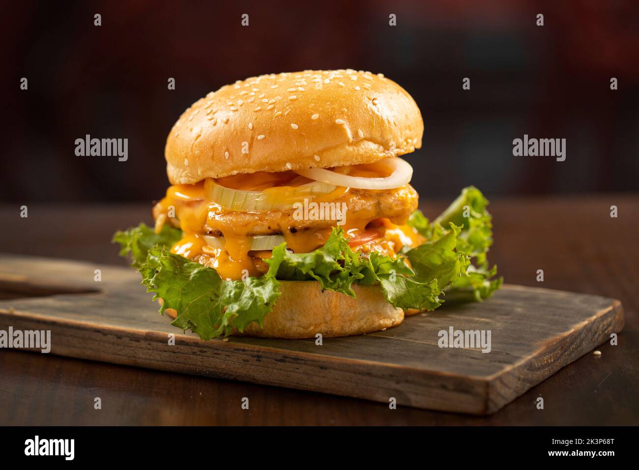 fresh tasty burger isolated on black texture background Stock Photo - Alamy