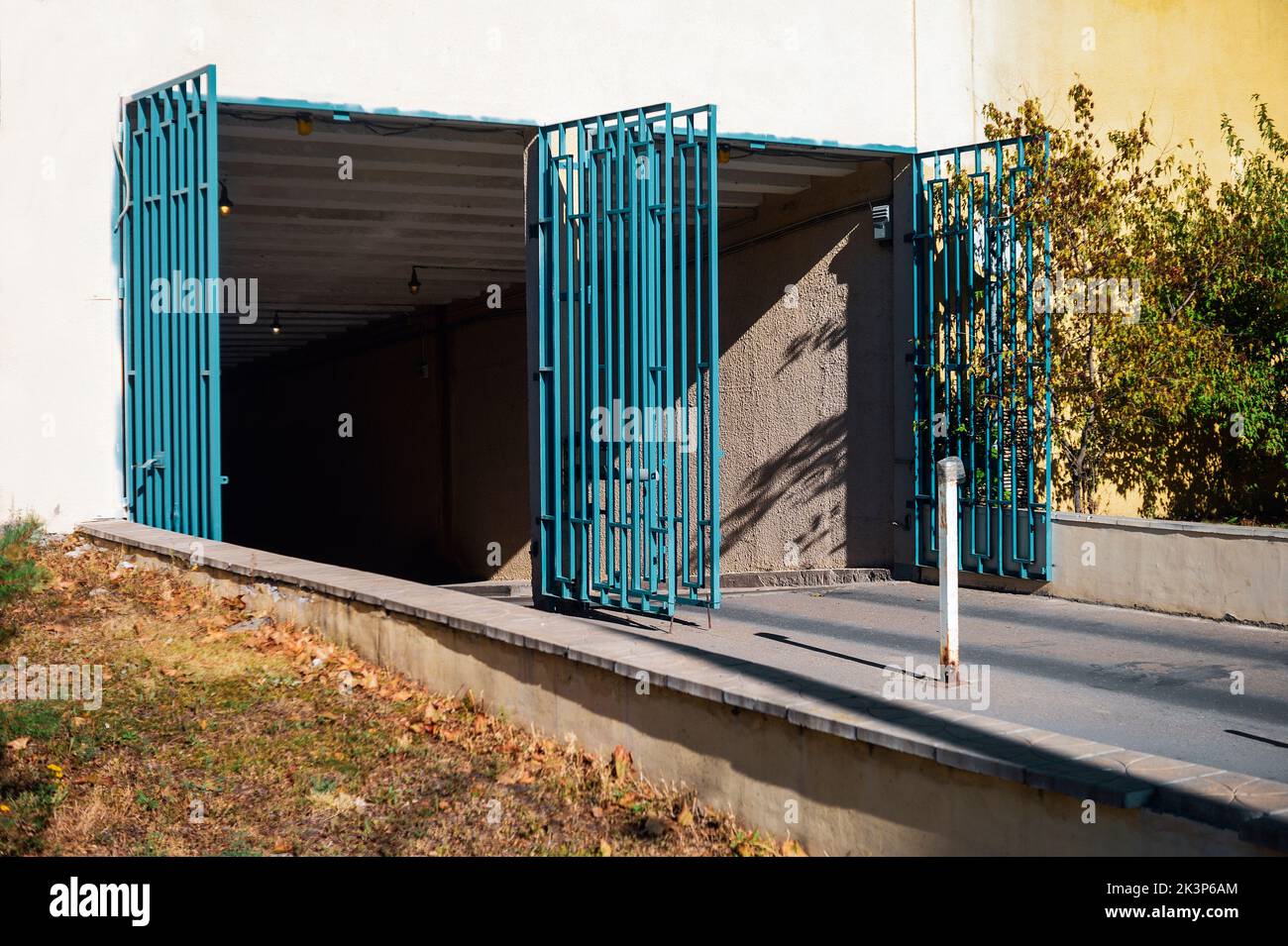 wall of a building with an open metal gates of a bunker, outdoor shot ...