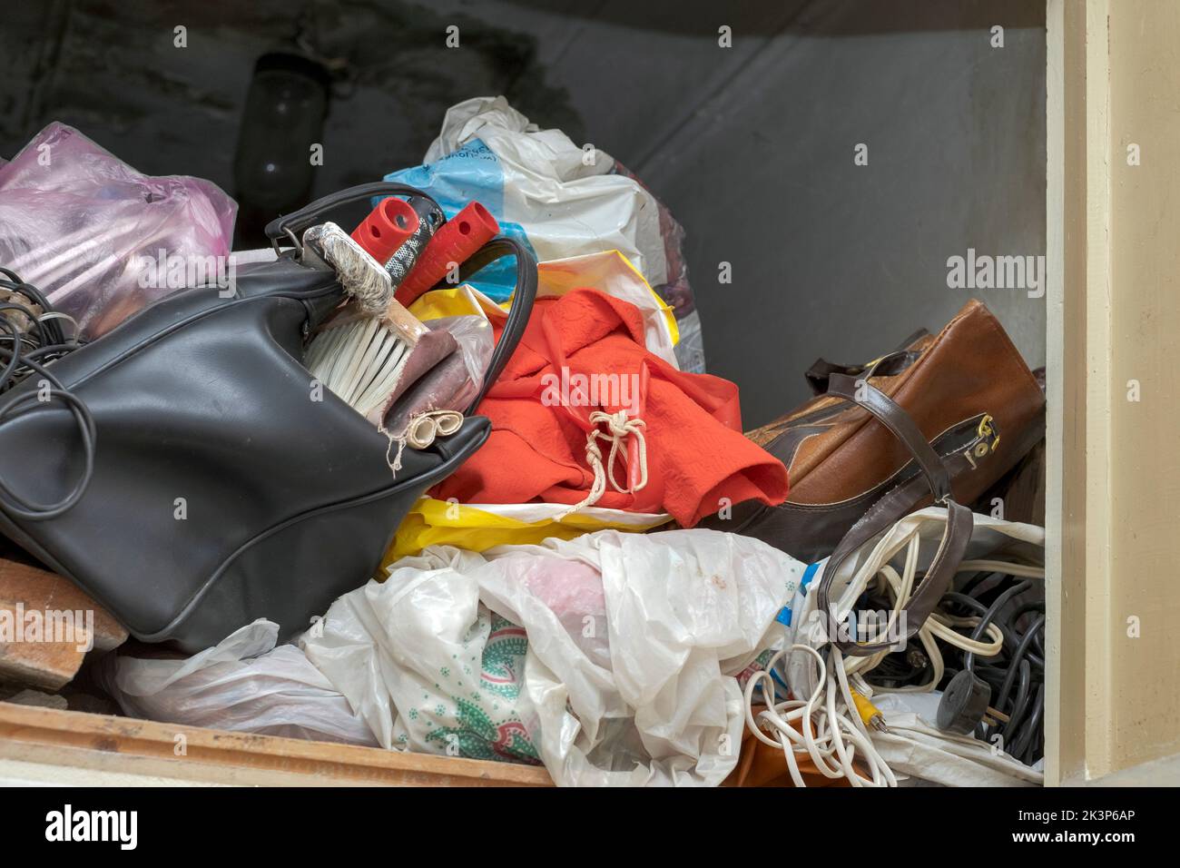 a pile of discarded household stuff in a closet, indoor shot Stock ...