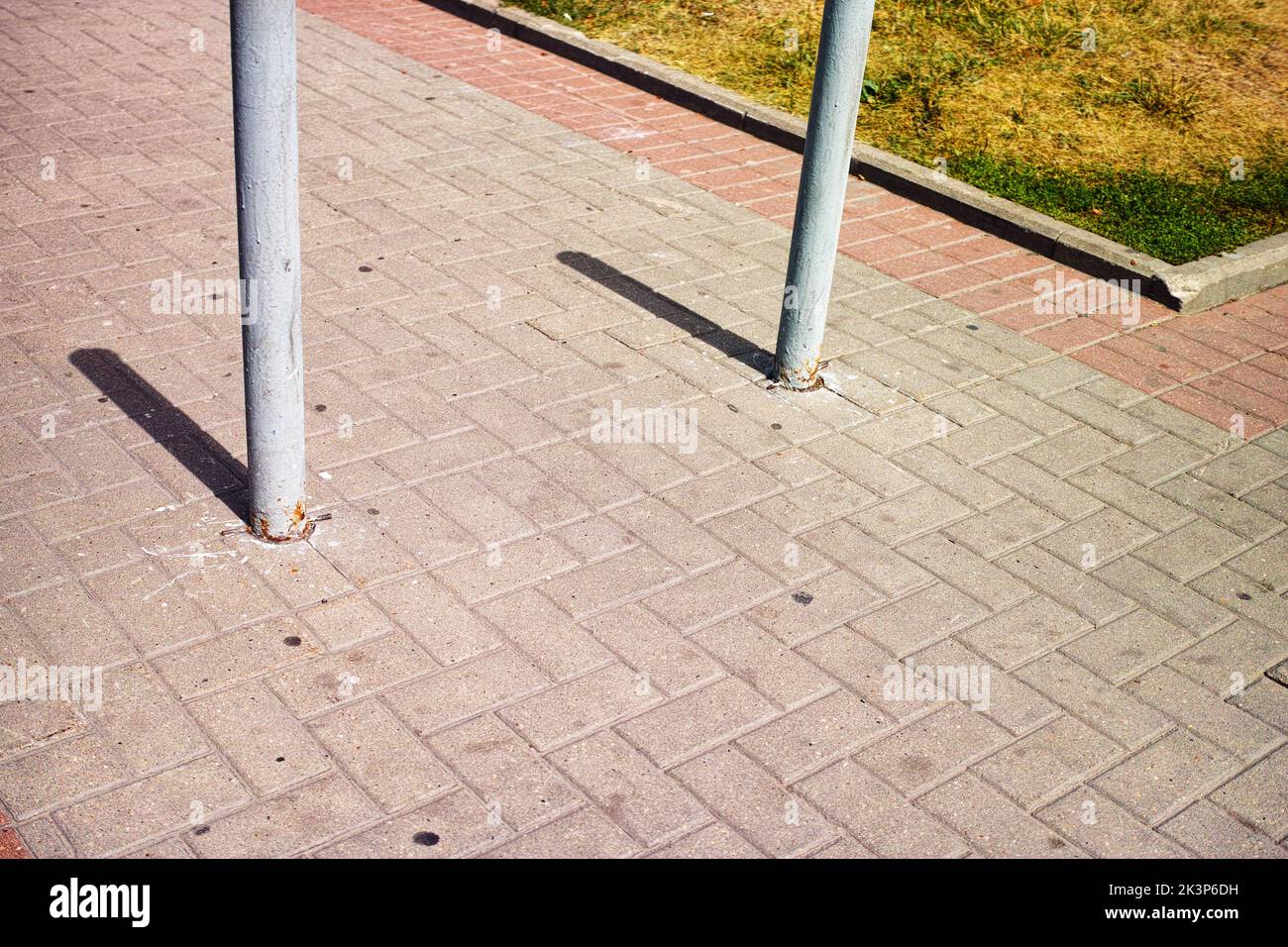 no trespassing beyond two metal posts arranged on tiled pavement Stock ...