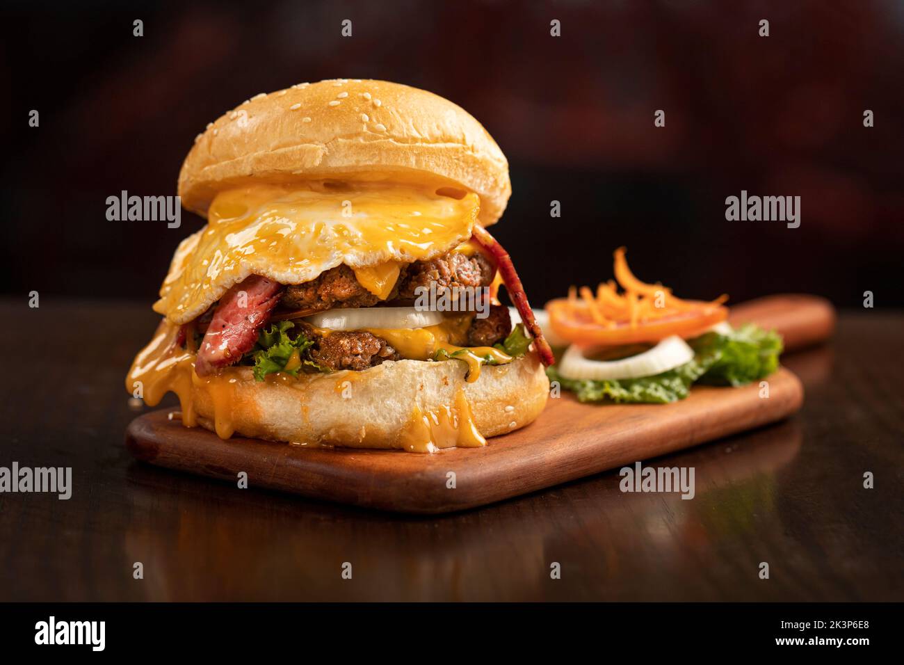fresh tasty burger isolated on black texture background Stock Photo - Alamy