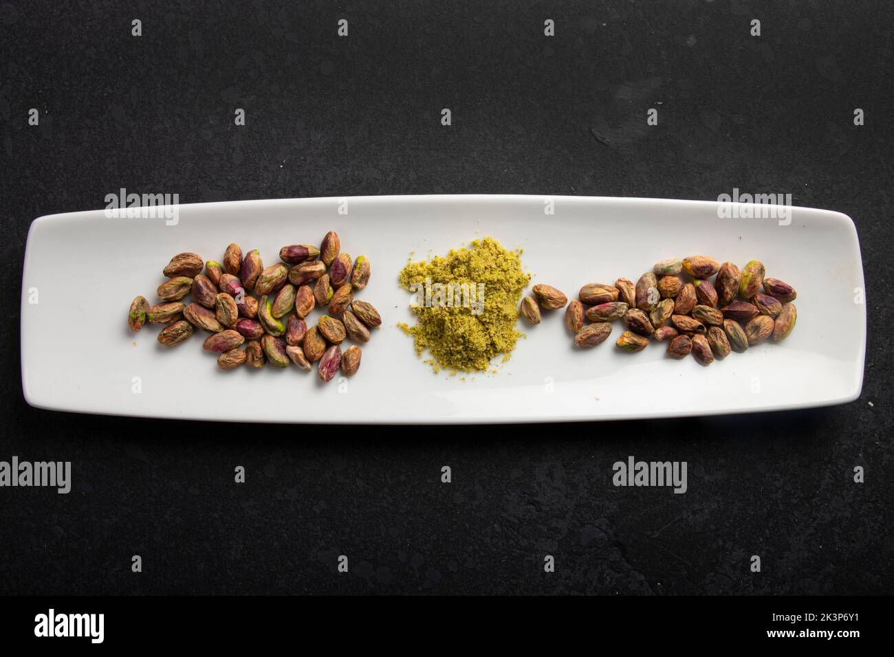 Nuts mix in a white plate Stock Photo - Alamy