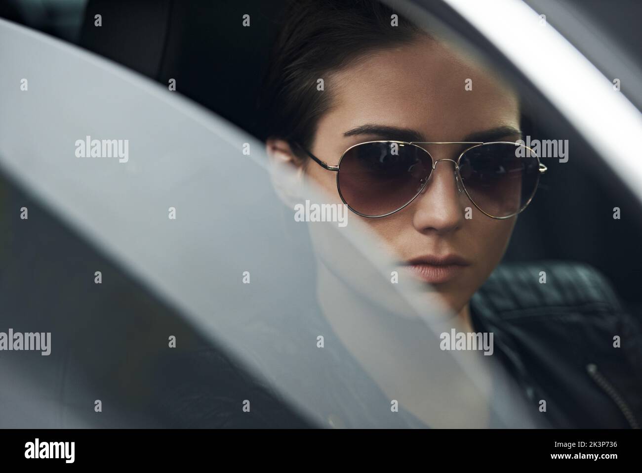 Where to go...an attractive young driver looking through the front ...