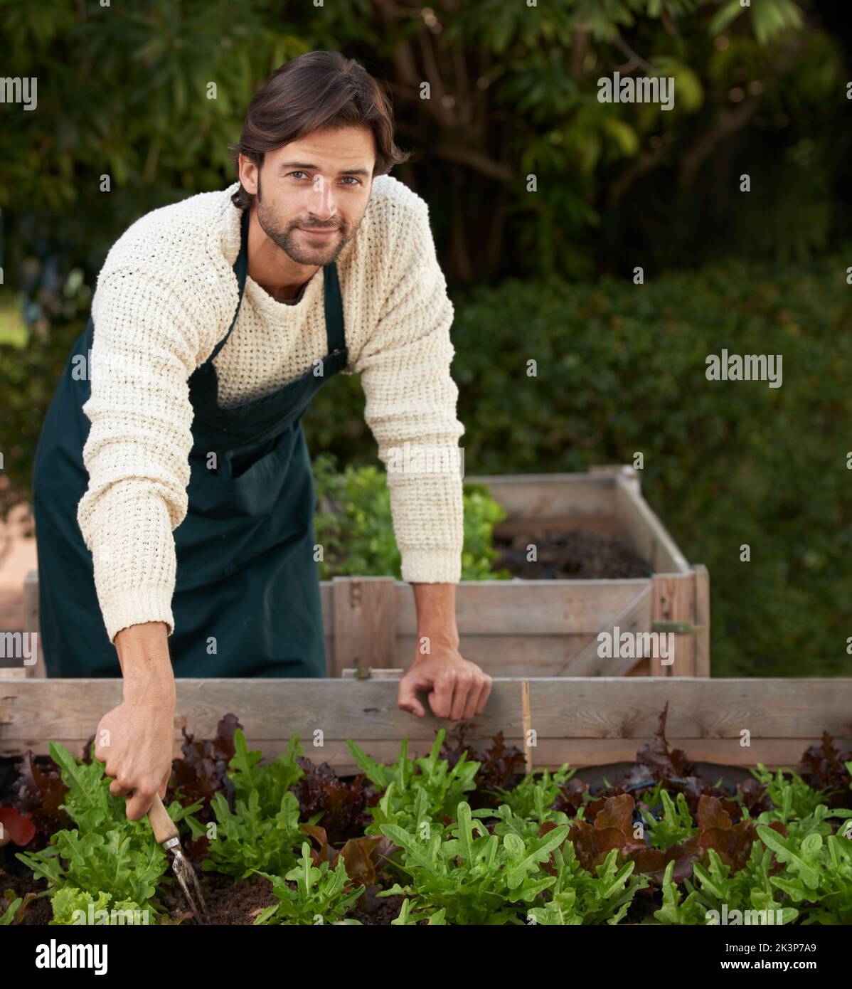 This is may hobby and passion. Portrait of a handsome young gardener ...