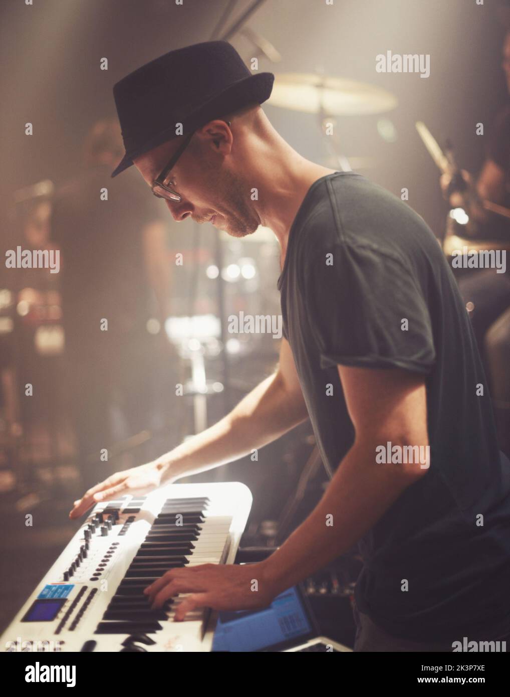 He has the world of music at his fingertips. A young man playing a ...