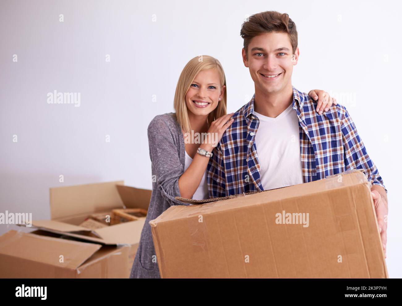 Weve moved into a bigger home. a happy young couple on their moving in ...
