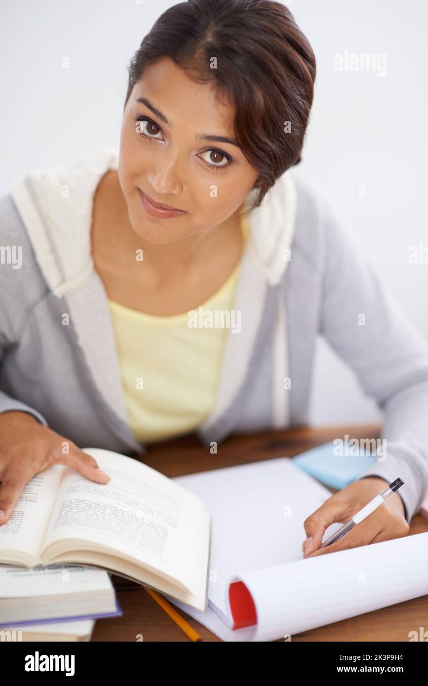 Studying hard for the upcoming exams. Closeup portrait of a pretty ...