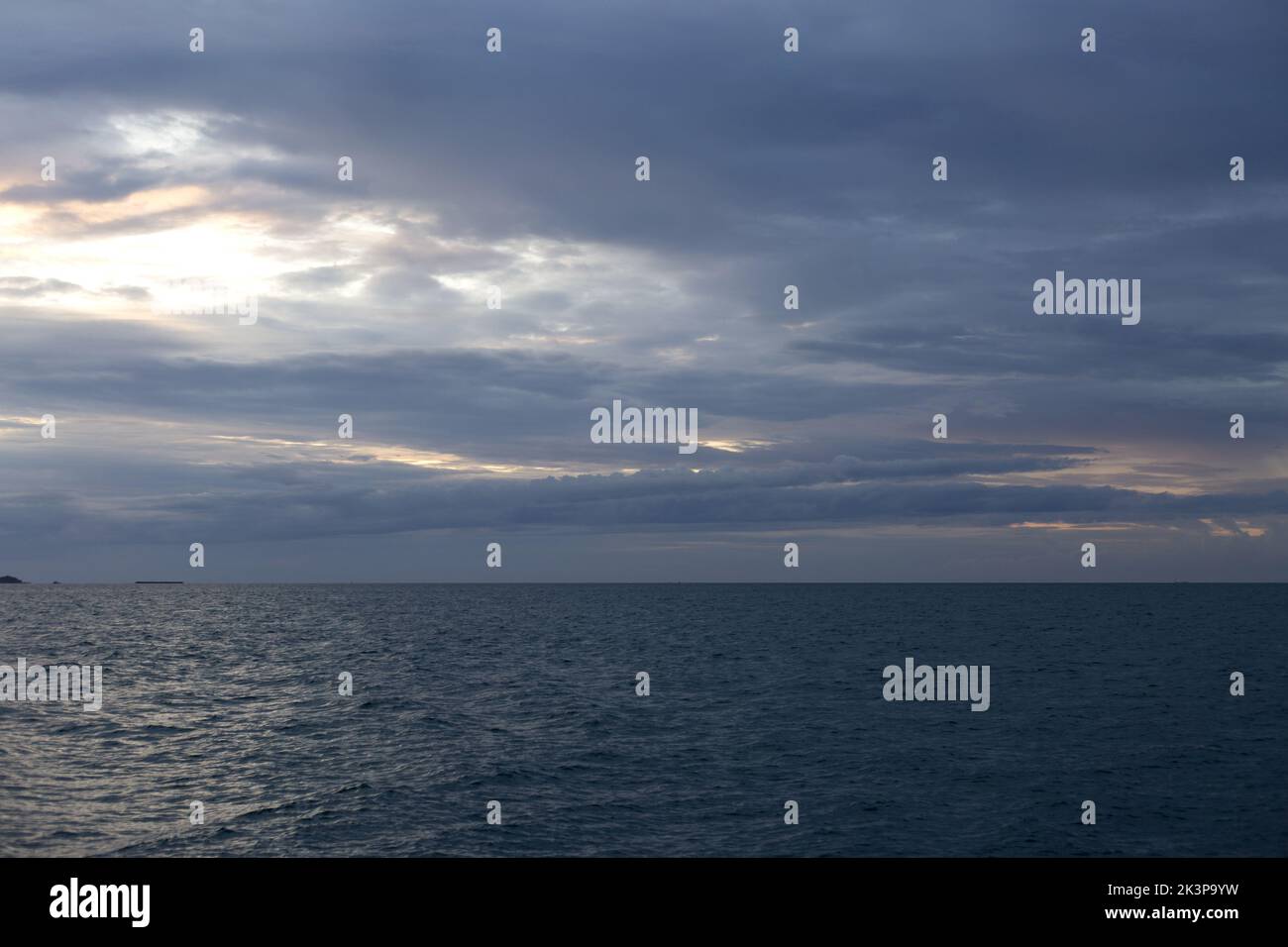Calm sea with sunset sky with cloud Stock Photo - Alamy