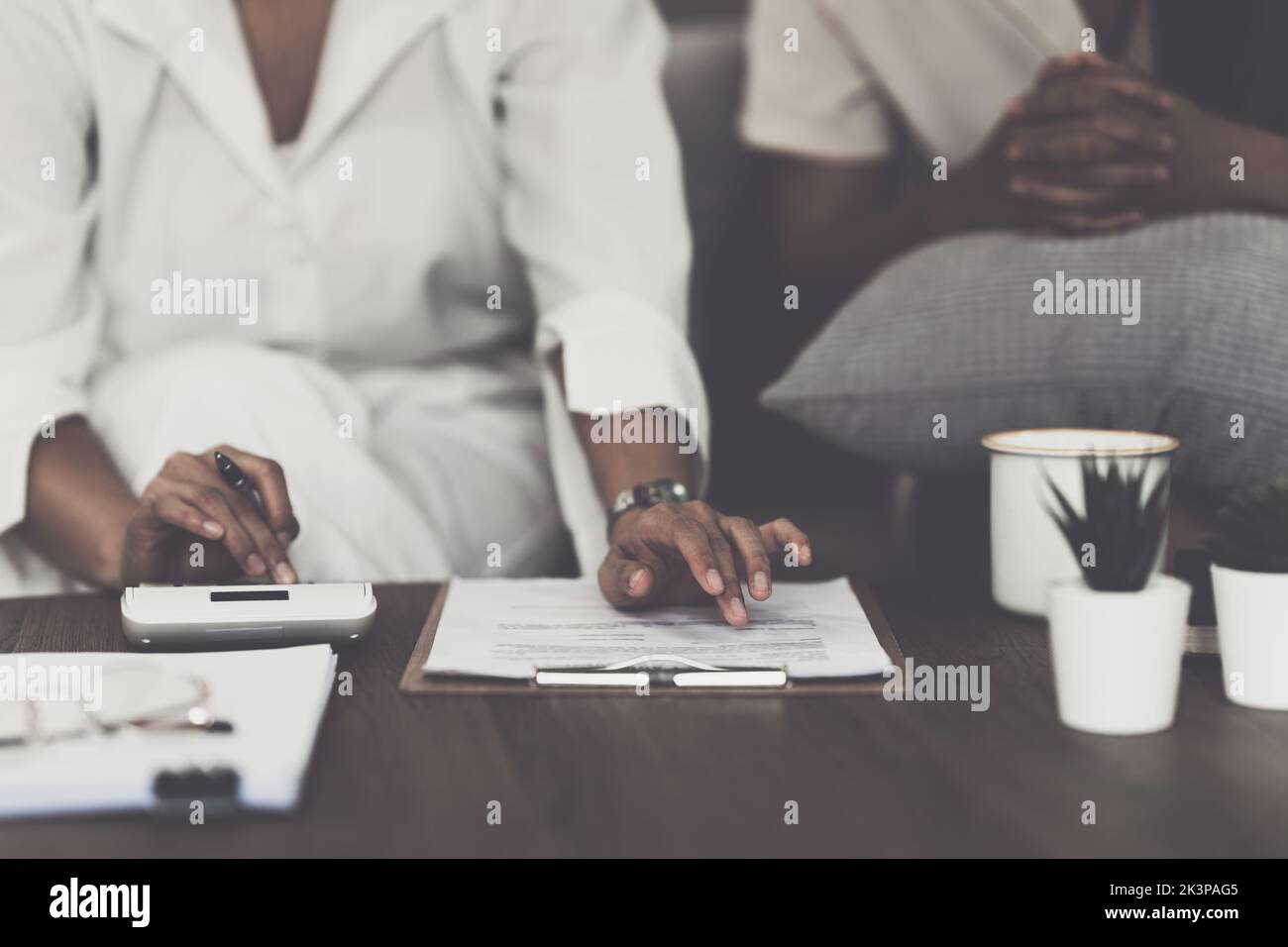 Real Estate Agent explain insurance and agreement contract to client ...