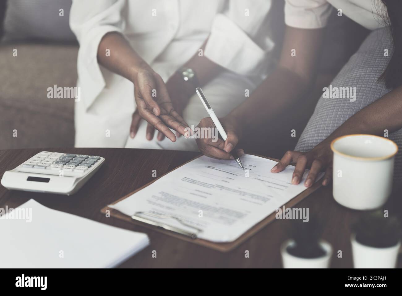 Real Estate Agent explain insurance and agreement contract to client ...