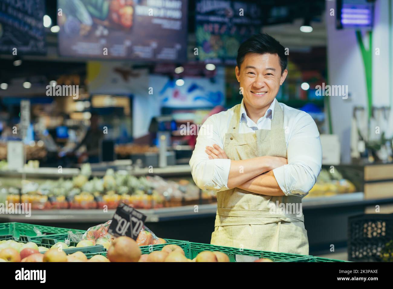 Portrait of a handsome young Asian man, owner and director, businessman ...