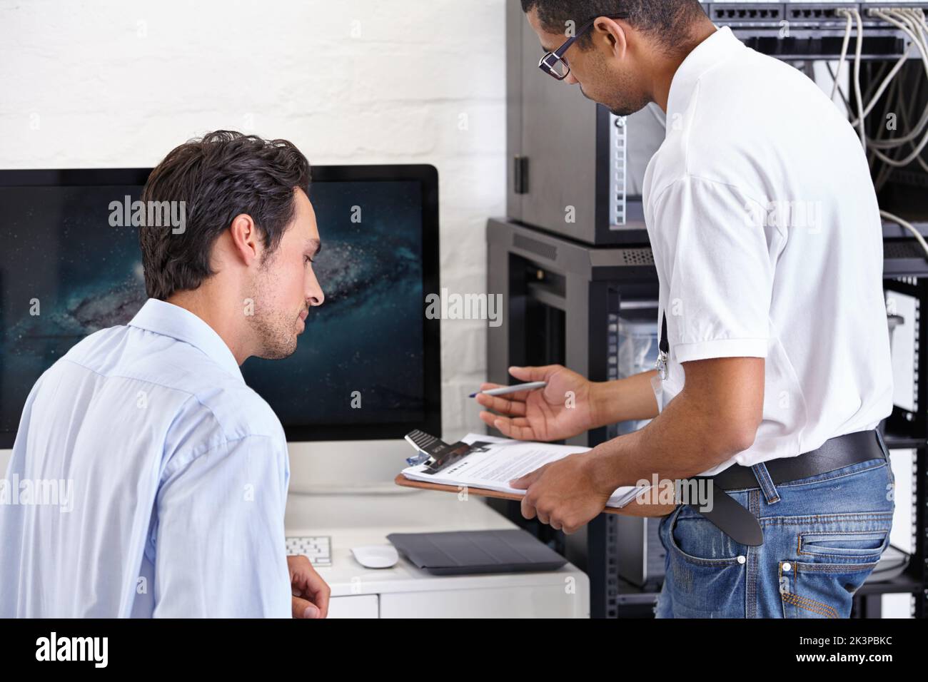 Technical diagnosis. A young IT specialist ready to fix a server Stock ...