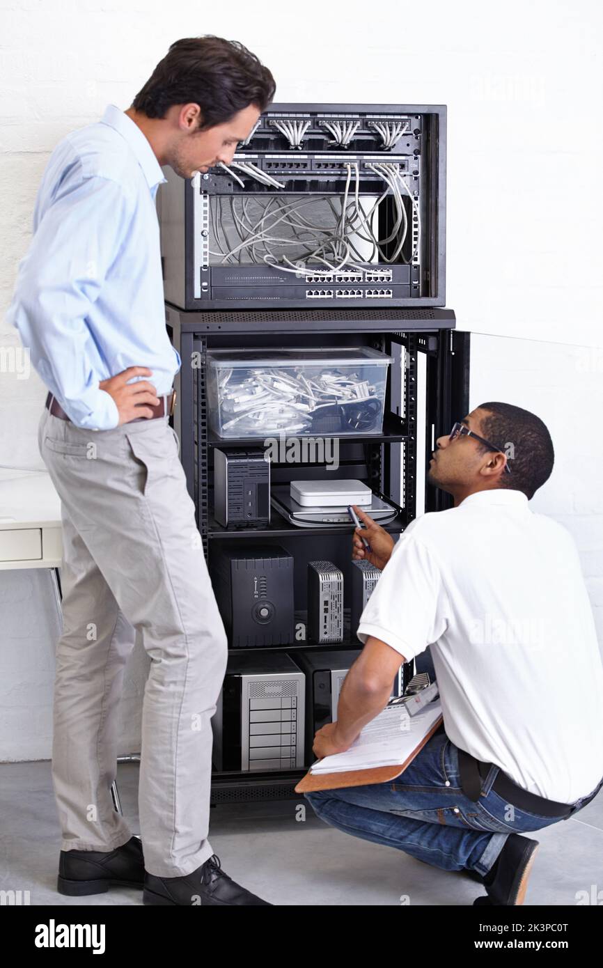 Hes got your IT needs covered. A young IT specialist ready to fix a ...