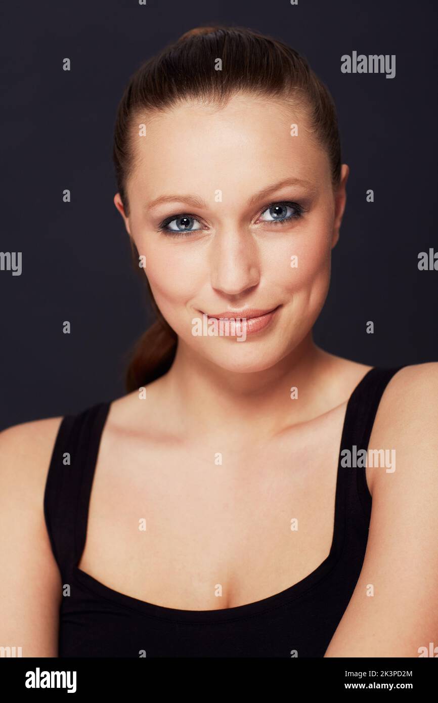 Giving you a natural smile. Portrait of an attractive young woman ...