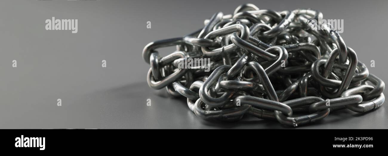 Grey chain folded in heap, steel metal iron chain on grey surface Stock ...