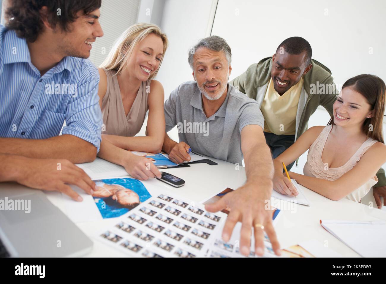 Choosing the best picture for the project. A group of designers ...