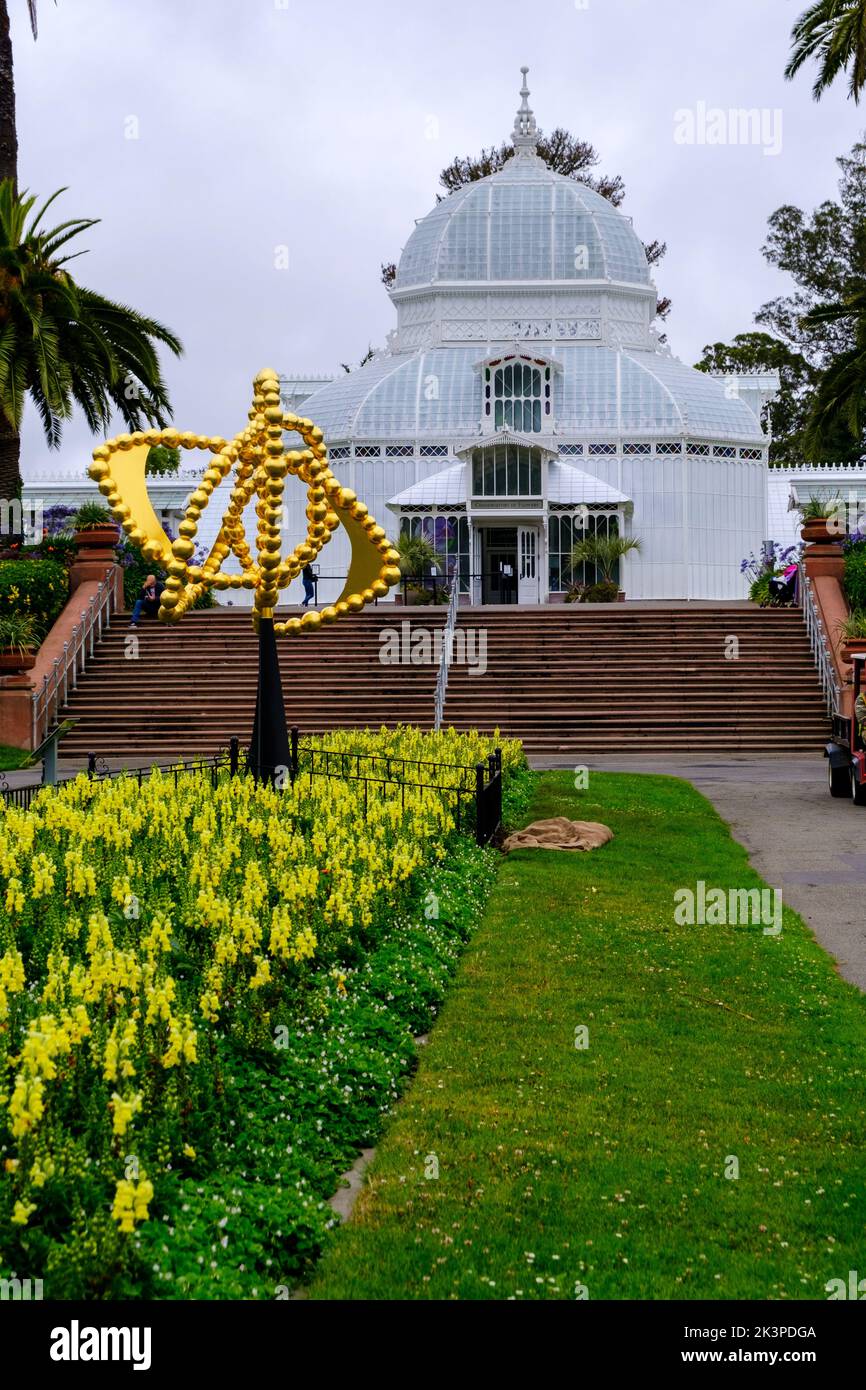 Conservatory of Flowers front lawn & flowerbeds with gold sculpture La ...