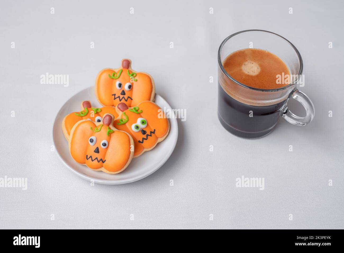hot espresso coffee or chocolate cup with funny Halloween Cookies ...