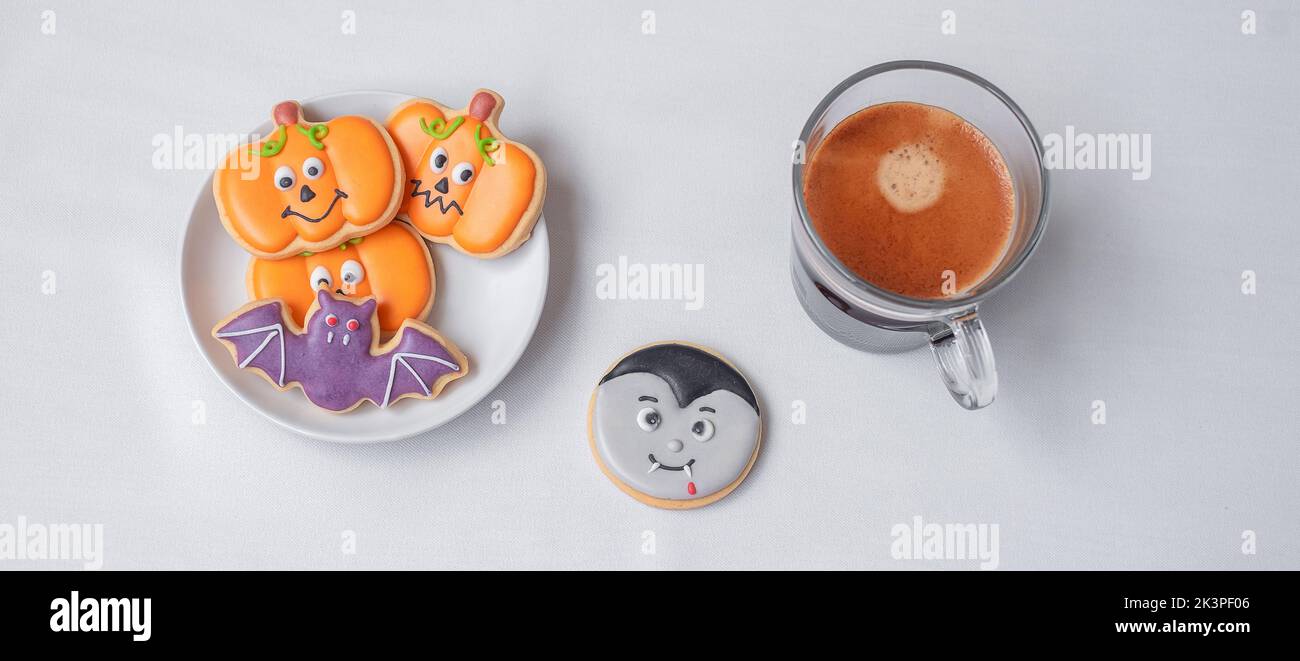 hot espresso coffee or chocolate cup with funny Halloween Cookies ...