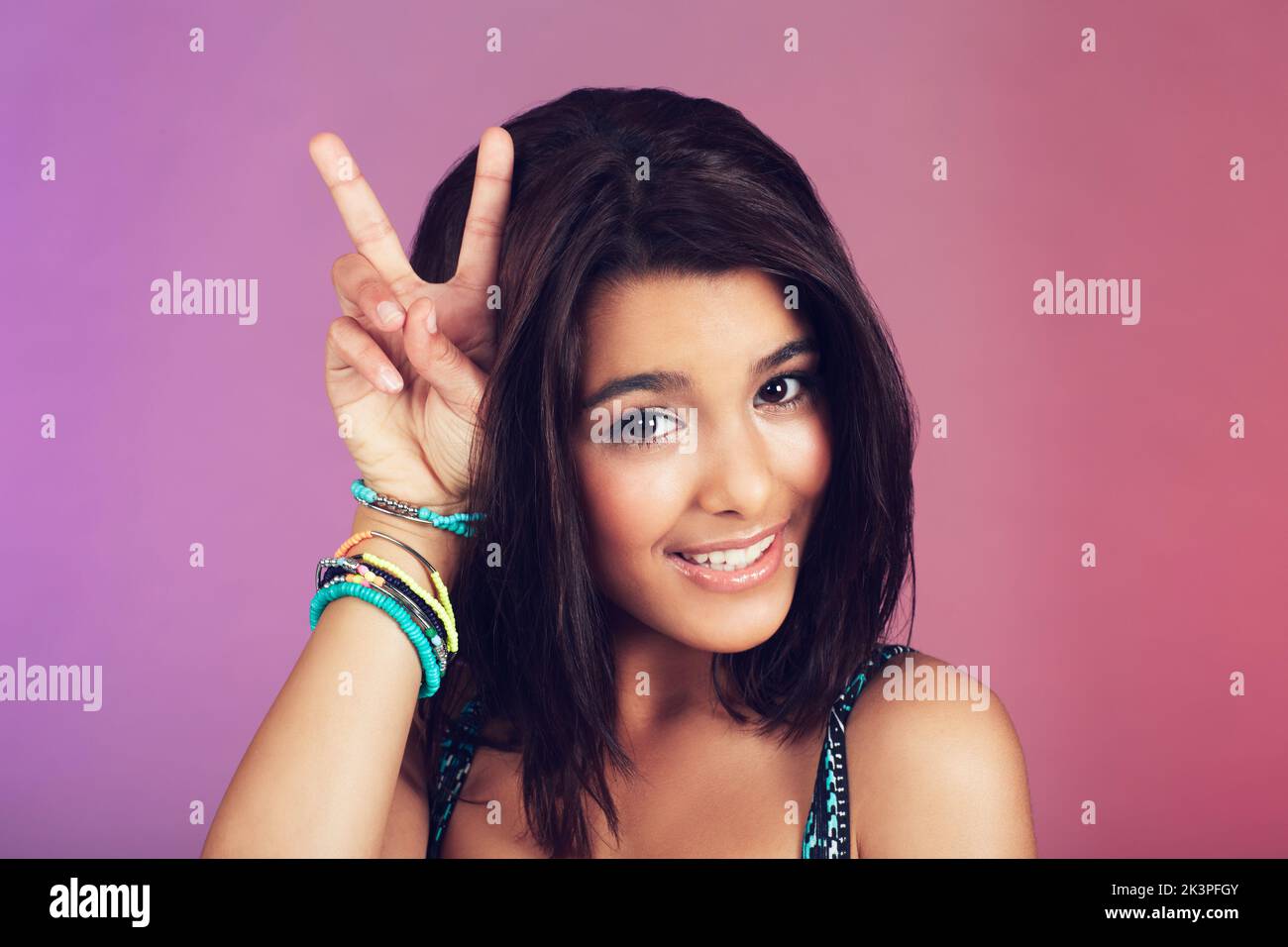 Keeping fashion fun. Studio shot of a beautiful young woman posing ...