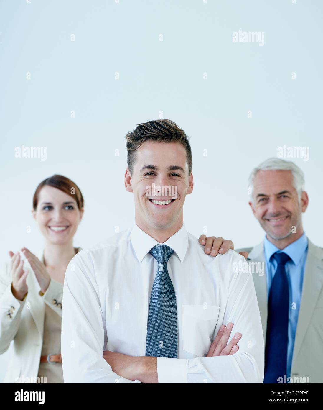 Another job well done. a three corporate coworkers in an office Stock ...