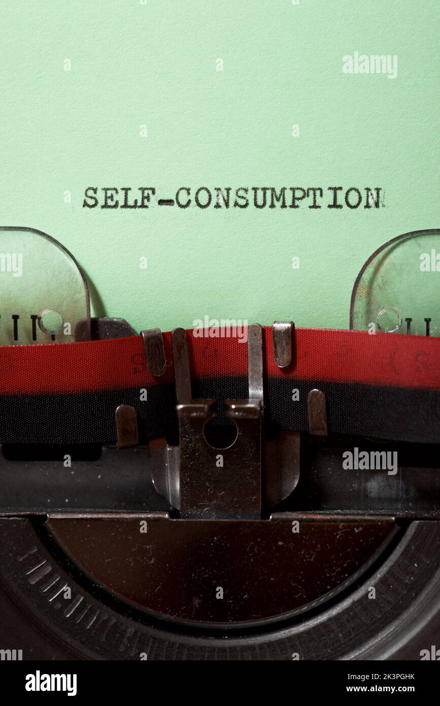Self consumption text written with a typewriter Stock Photo - Alamy