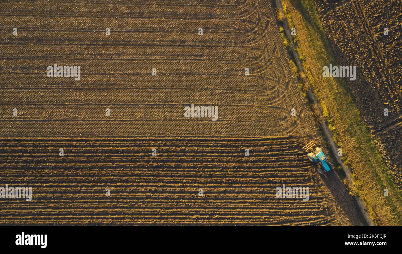 Farmer cultivating land tractor high hi-res stock photography and ...