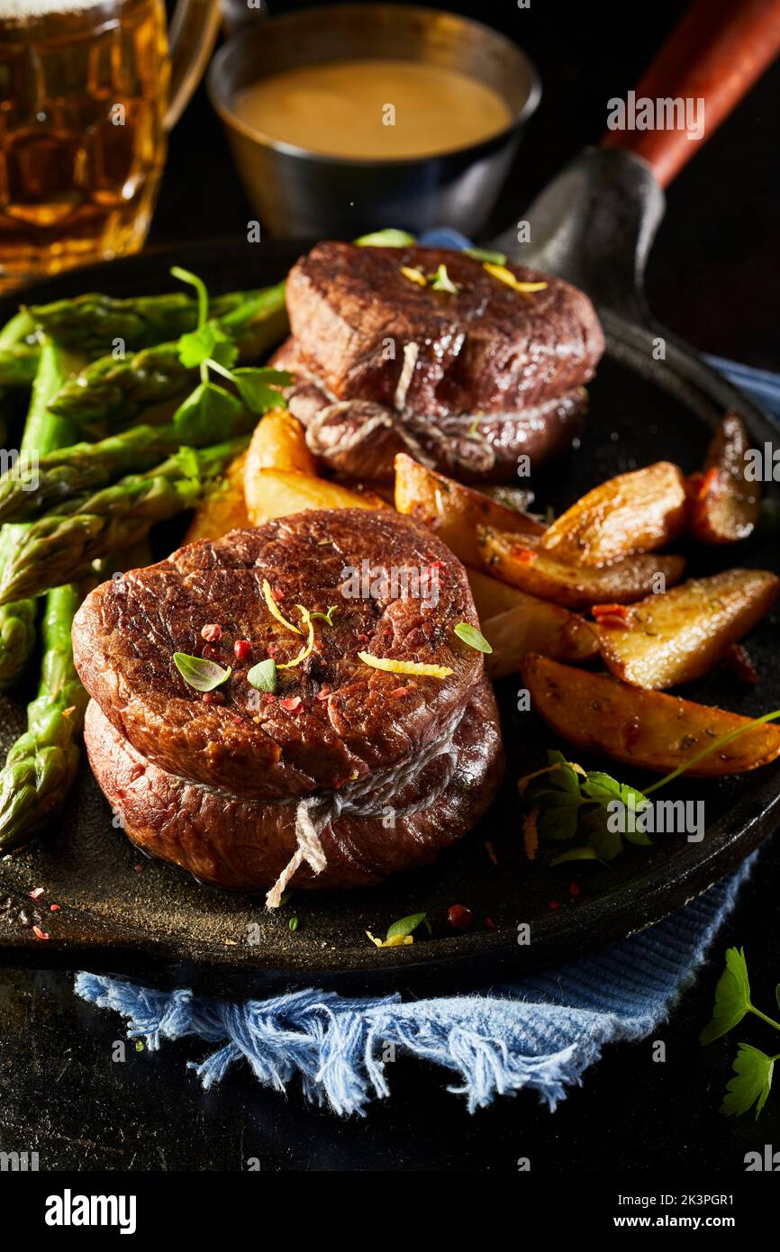 From above delectable beef medallions with asparagus and potato served ...