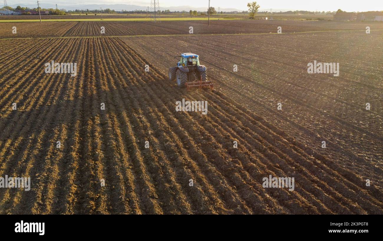 Farmer cultivating land tractor high hi-res stock photography and ...