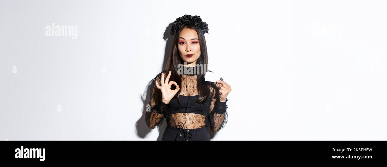 Portrait of confident asian woman assuring you in something, wearing ...