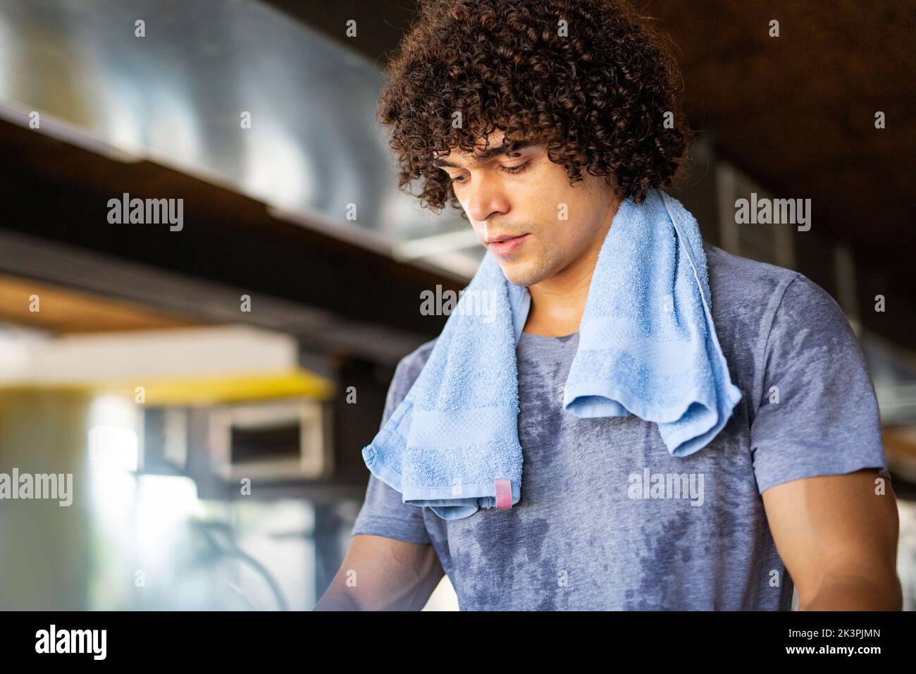 Fit man taking break from working out in gym. Stay healthy concept ...