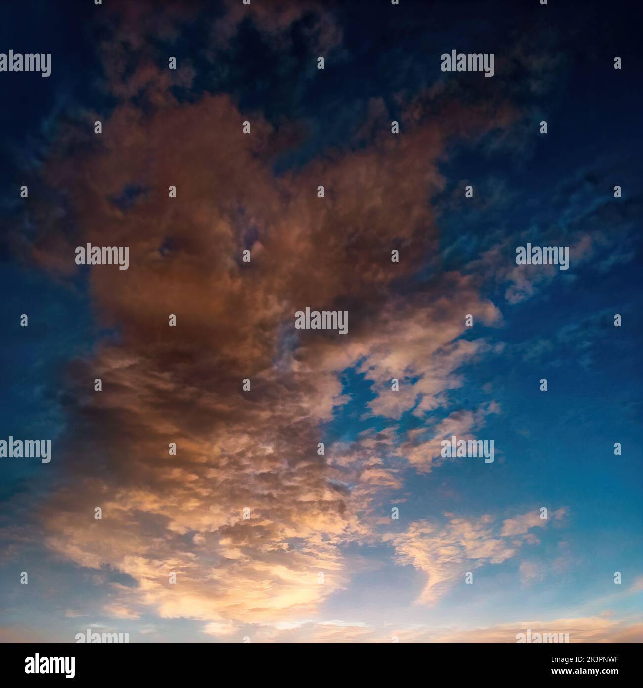 Blue sky with warm color from sunset during cloudy day Stock Photo - Alamy