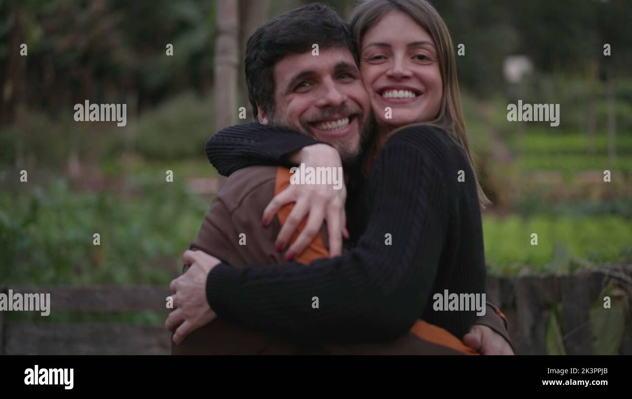 Two friends embrace. male and female people hugging each other at night ...